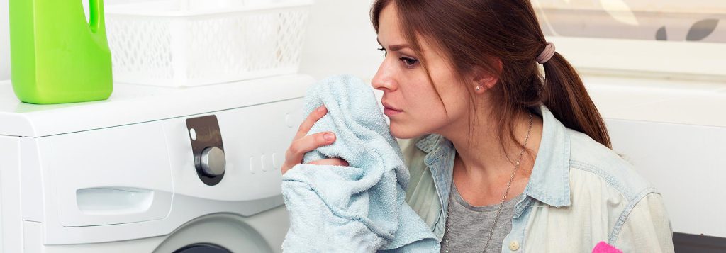 How to Clean a Smelly Washing Machine - Just Fixed
